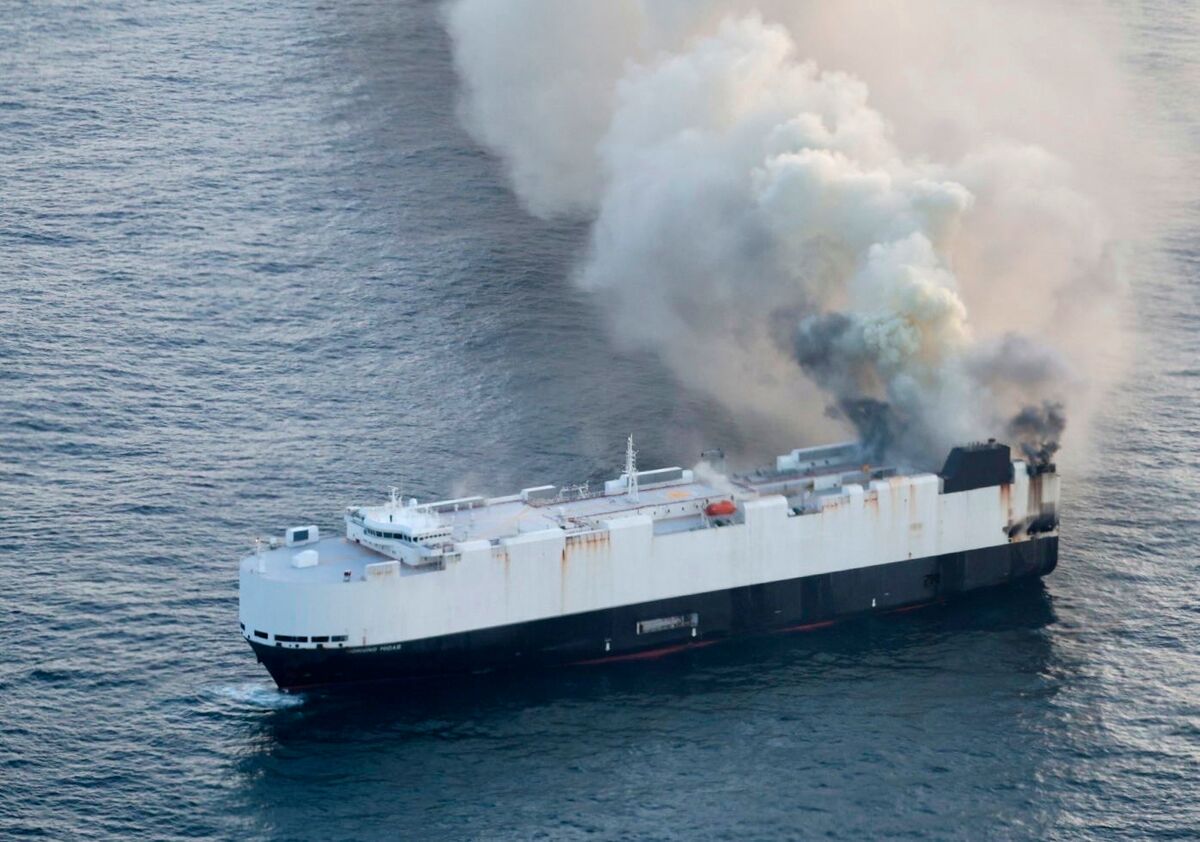 Ship Carrying EVs Abandoned in Pacific After Catching Fire - Bloomberg
