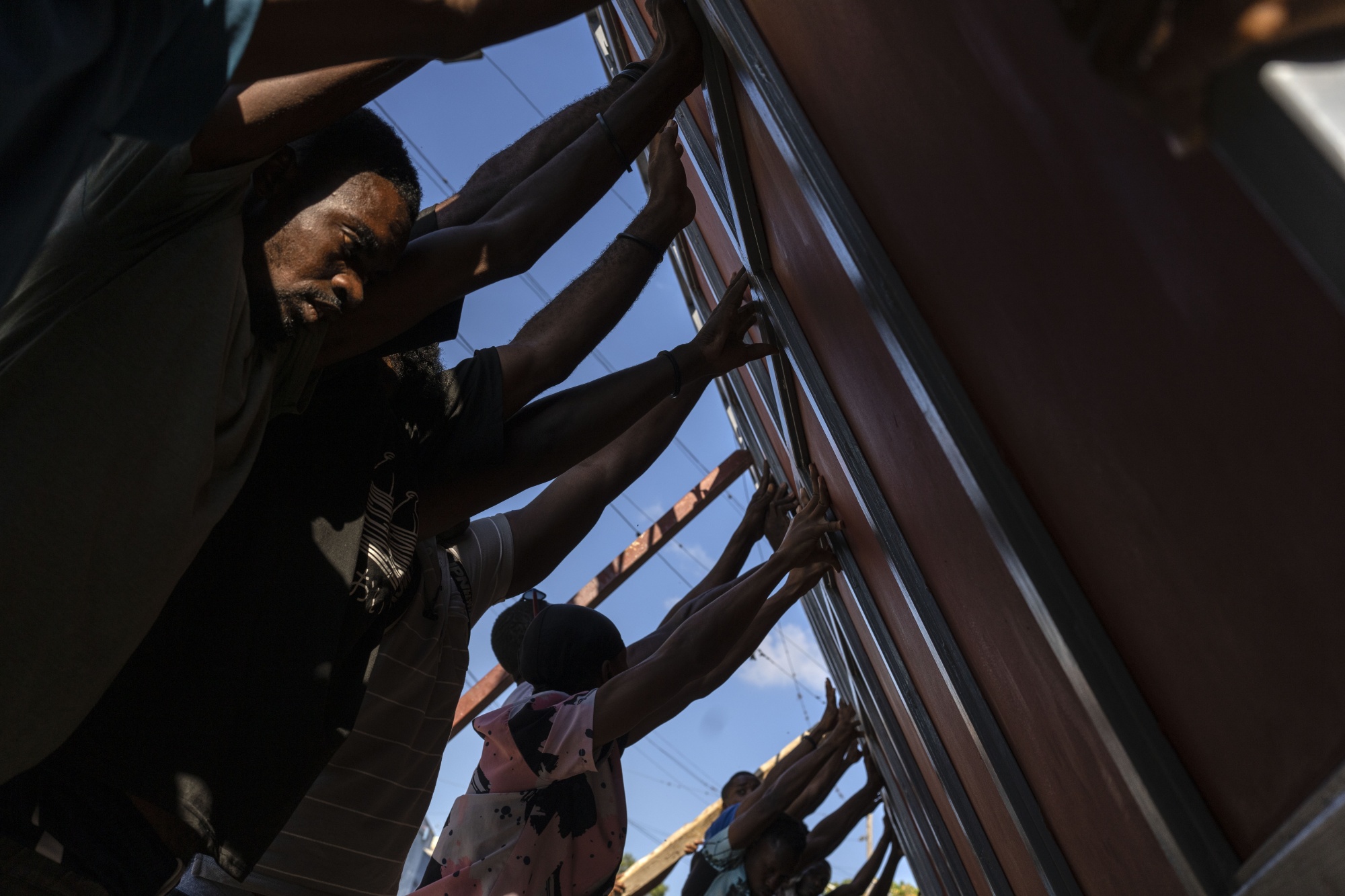 Haitians scramble to survive, seeking food, water and safety as gang ...
