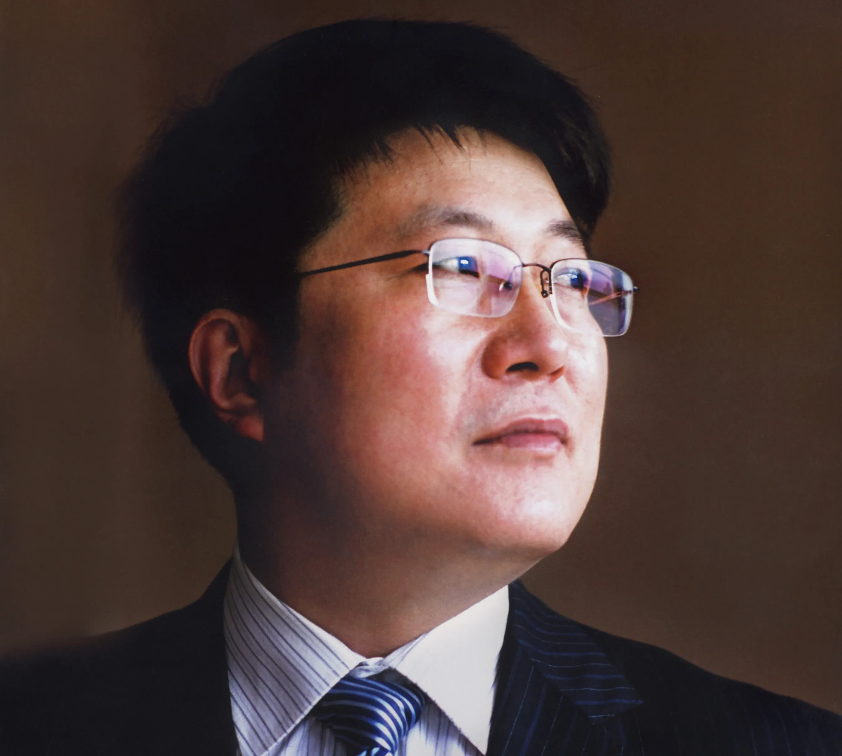 Tsinghua's Zhao Touts $30 Billion Arsenal on Path to Chip Giant - Bloomberg