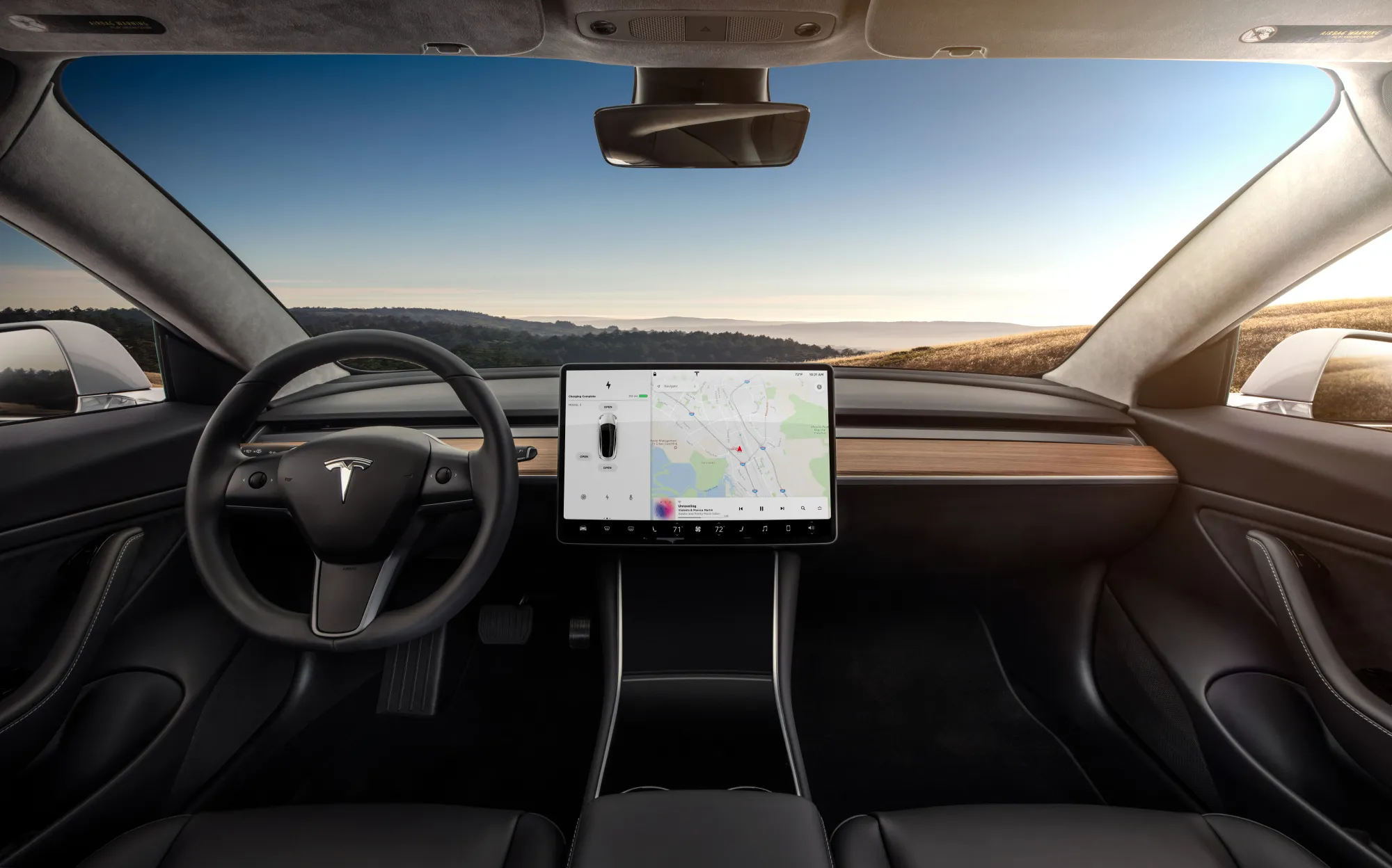 Tesla s Model 3 Arrives With a Surprise 310 Mile Range Bloomberg