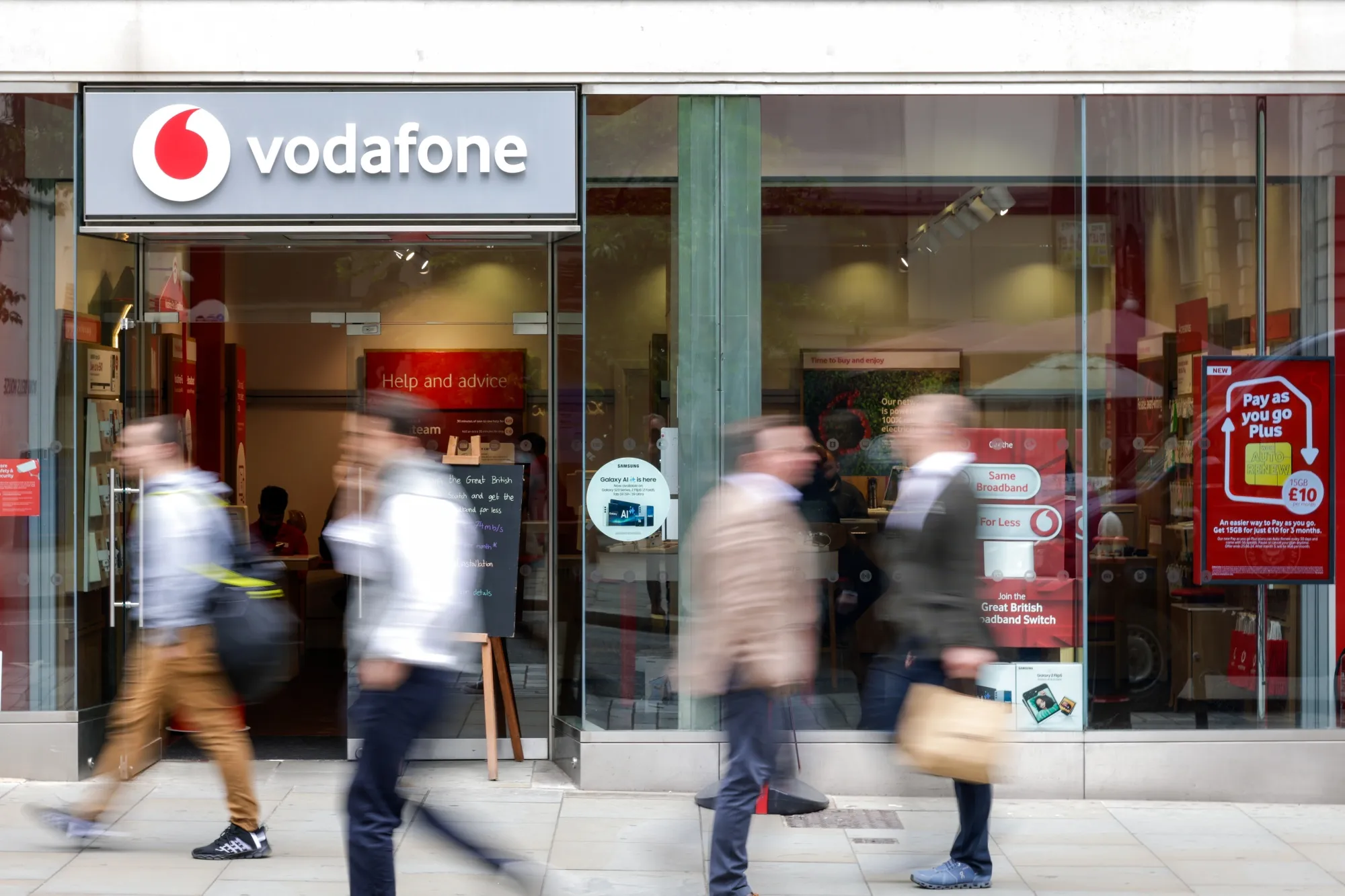 UK Signals Vodafone-Three Deal Approval On Network Investment - Bloomberg