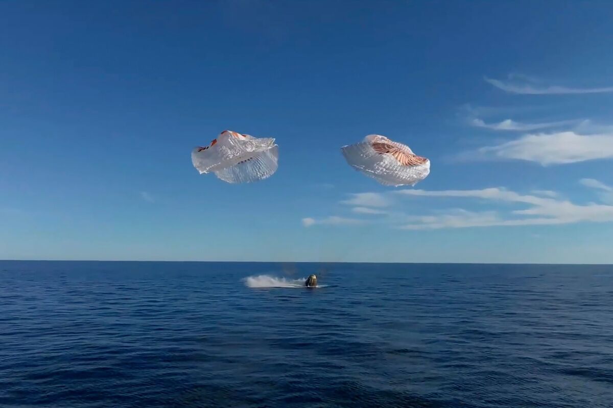 NASA Astronauts Back on Earth After Months Stuck in Space - Bloomberg