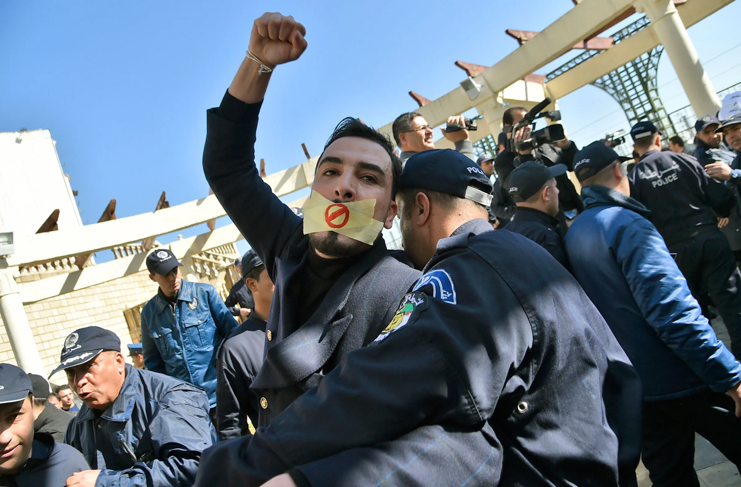 Algeria Clamps Down as Protests Build Versus Aging President - Bloomberg