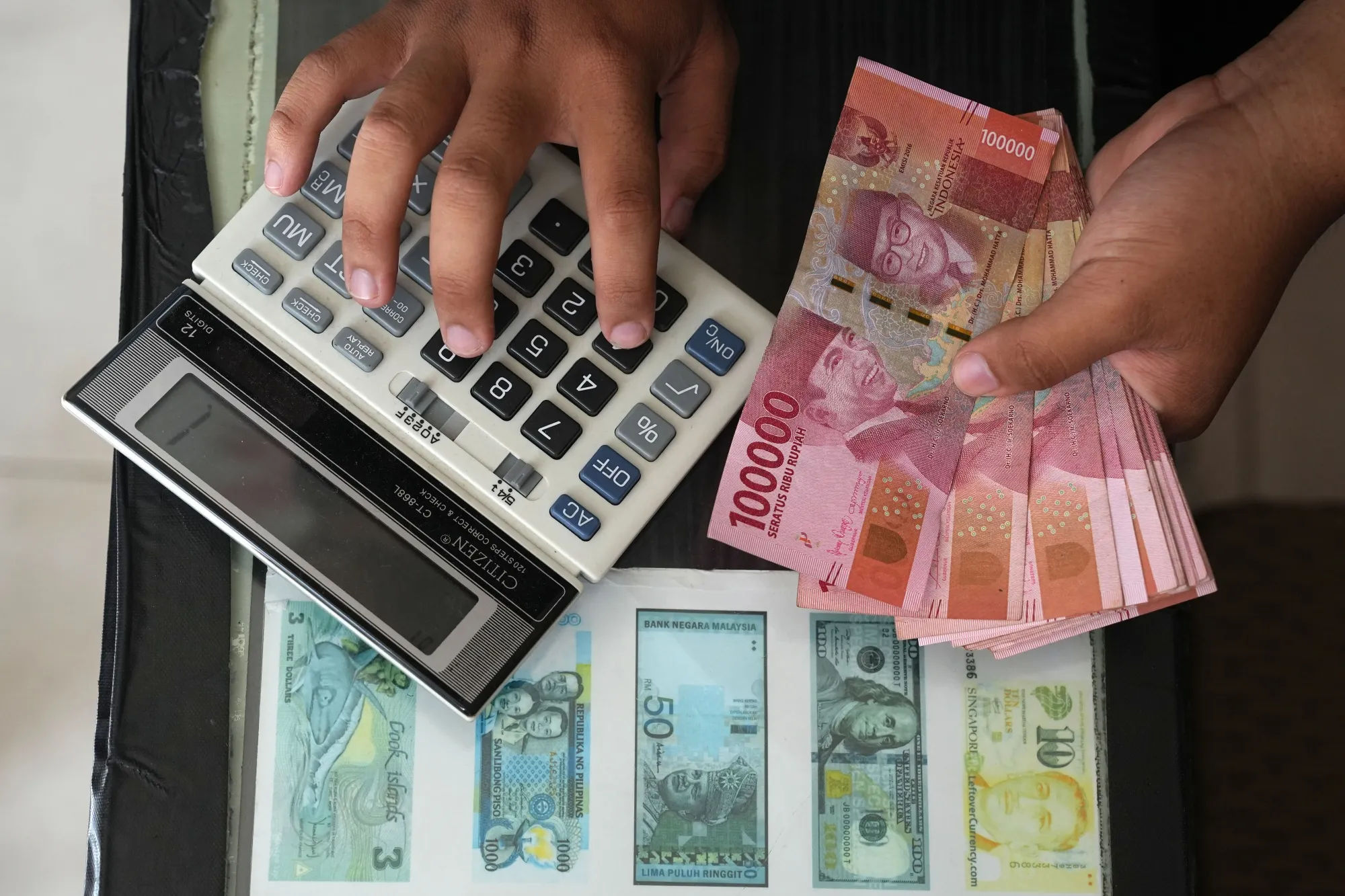 Rupiah Rout, Surprise Rate Hike Weigh on Indonesian Borrowers - Bloomberg