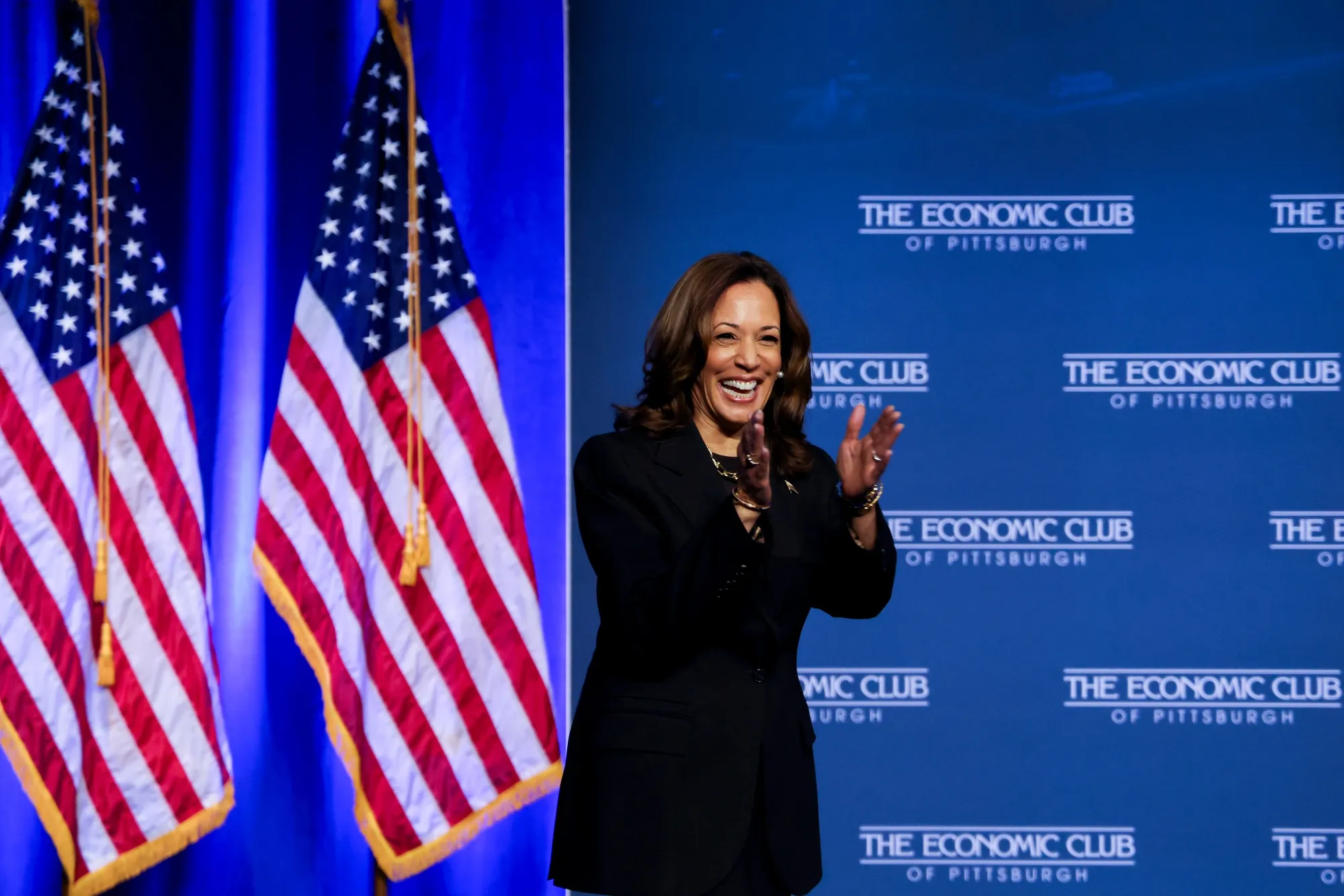 Harris Is Catching Up With Trump on Economy, New Poll Finds - Bloomberg