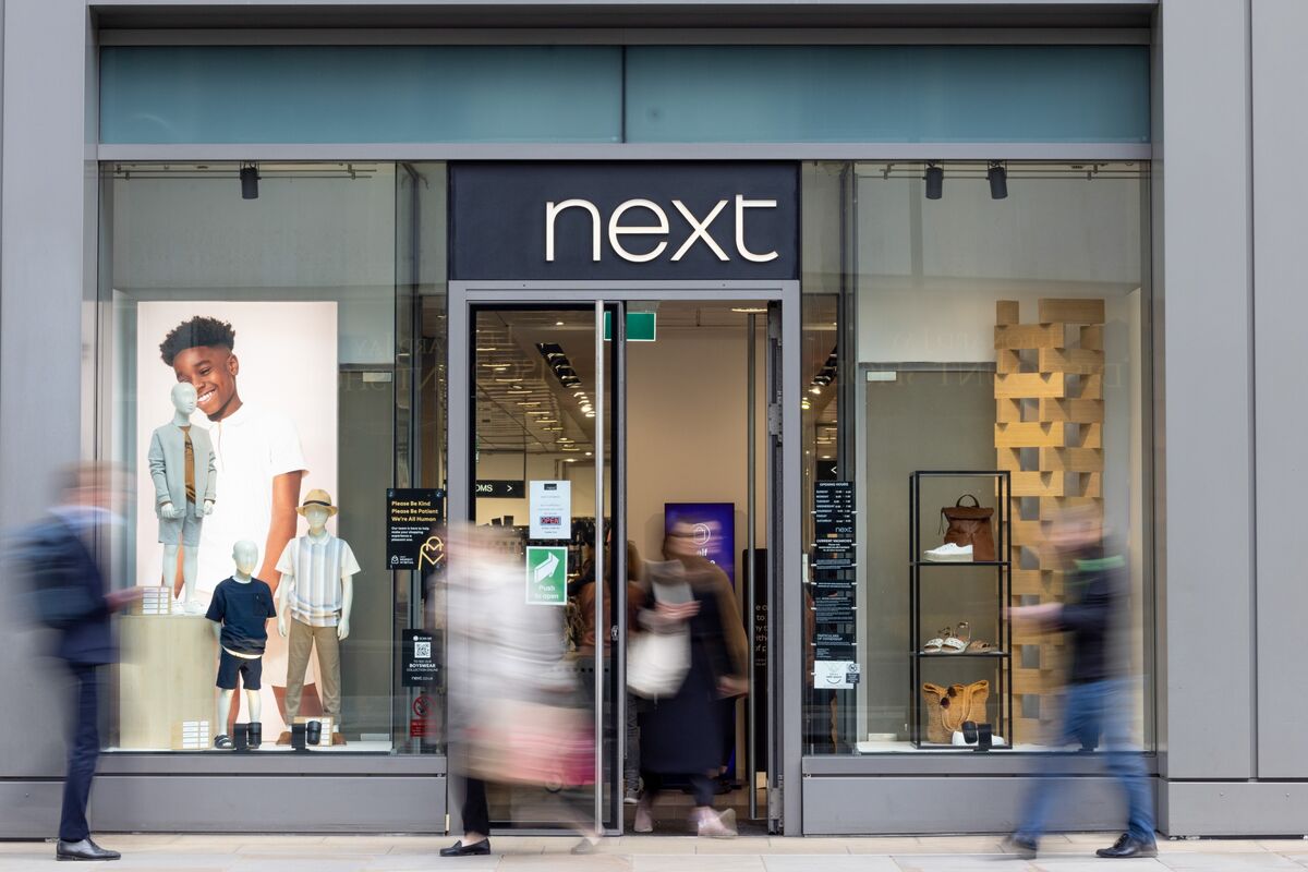 Next Trims Expected Price Hikes as Costs Fall: The London Rush - Bloomberg