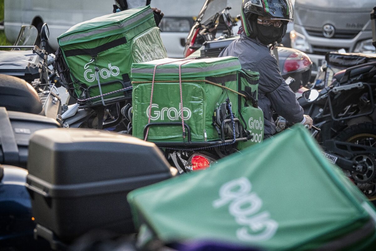 Grab Brings Forward Profit Goal After Quarterly Loss Narrows - Bloomberg