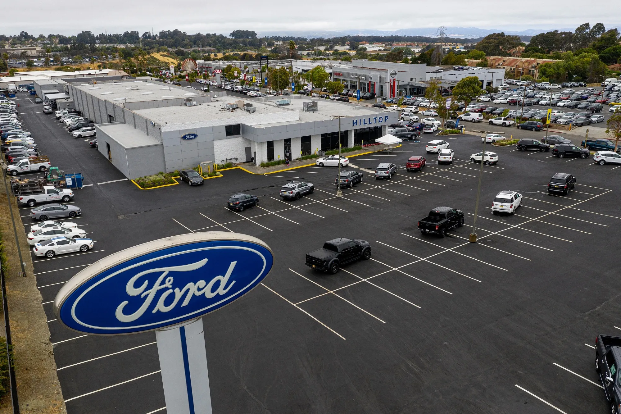 Why Nearly Empty Auto Lots Make This Pump-Price Shock Different - Bloomberg