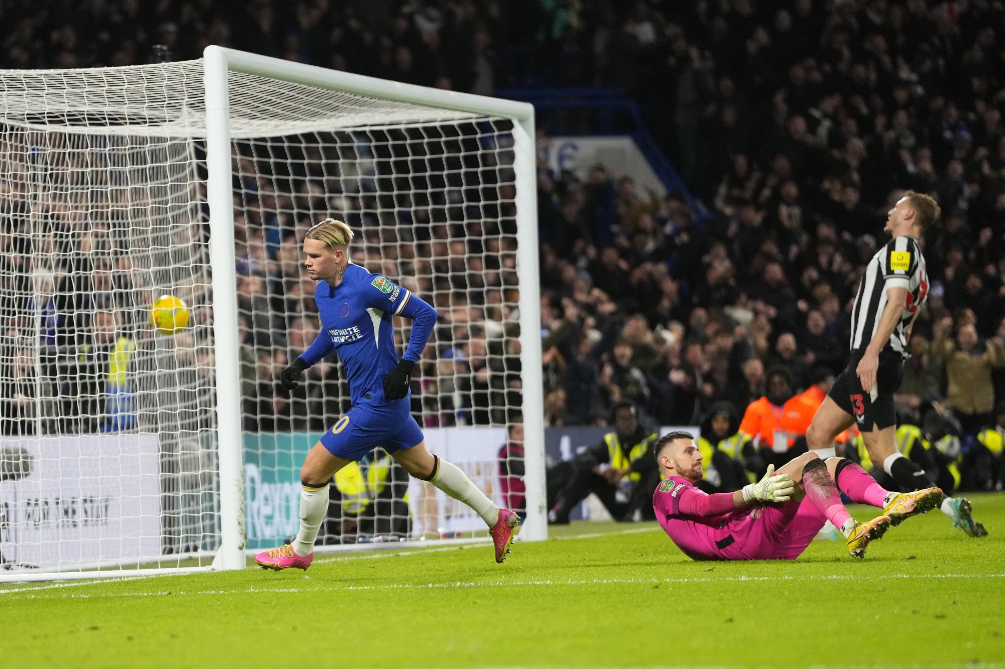 Newcastle goalkeeper Martin Dubravka confronted by a fan on the field ...