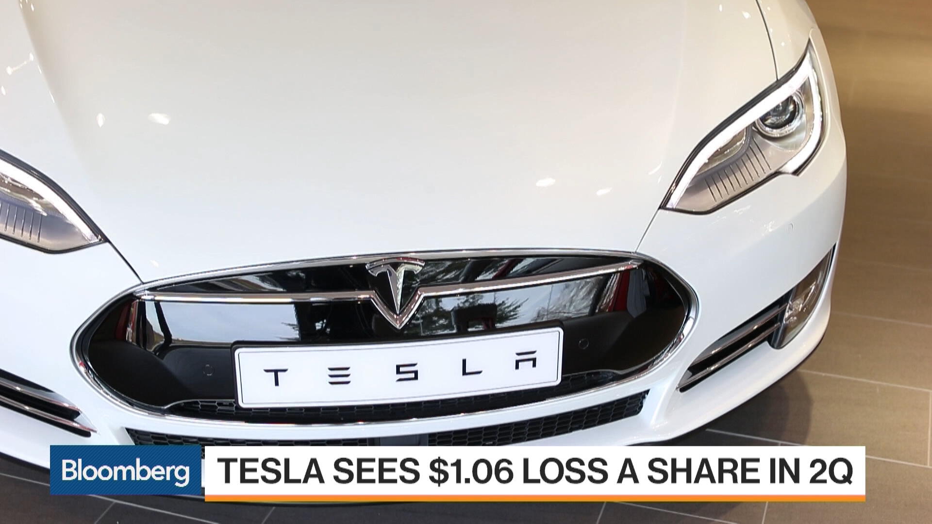 Tesla Forecast Eases 2Q Loss Sting