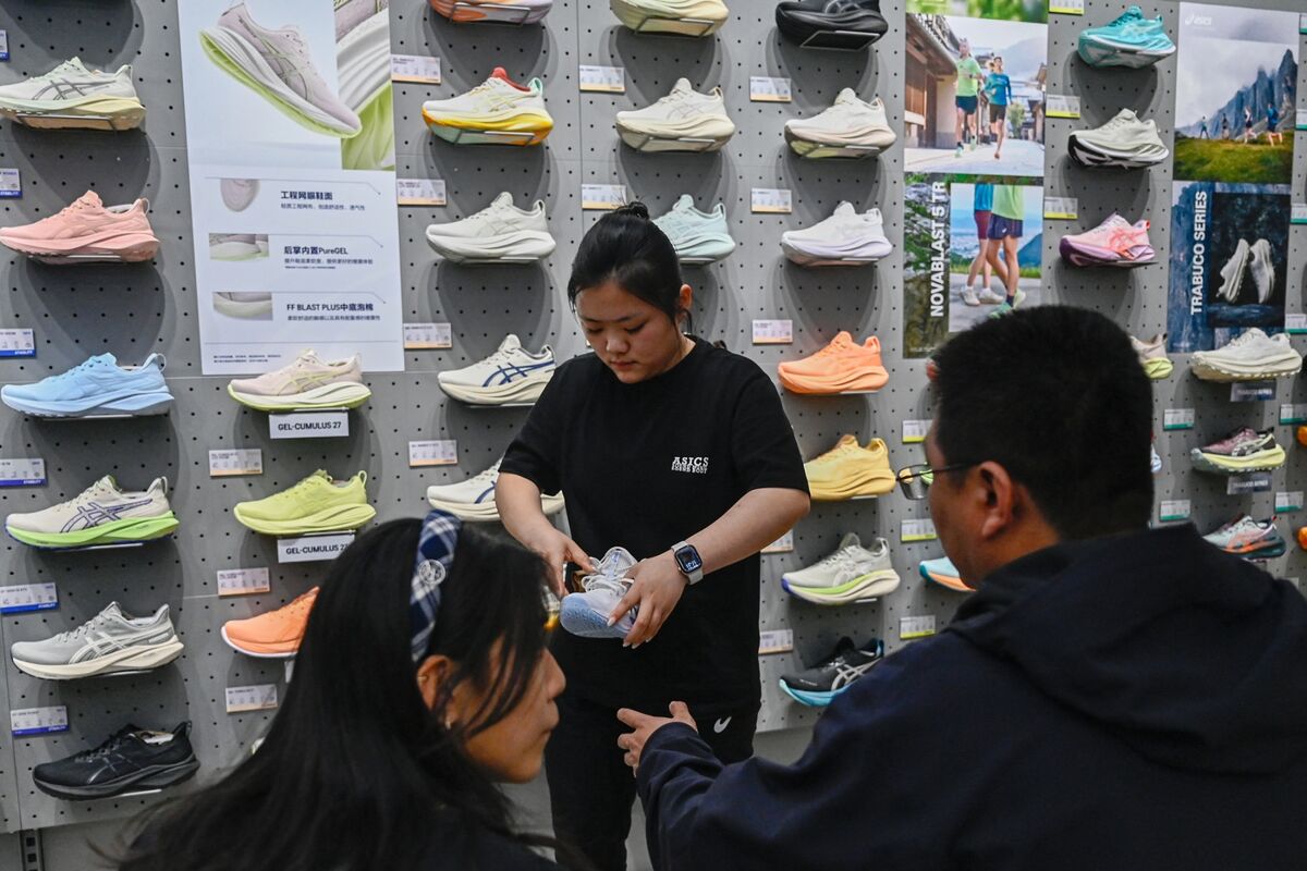 Asics Shares Surge as Raised Guidance Predicts Record Profit - Bloomberg