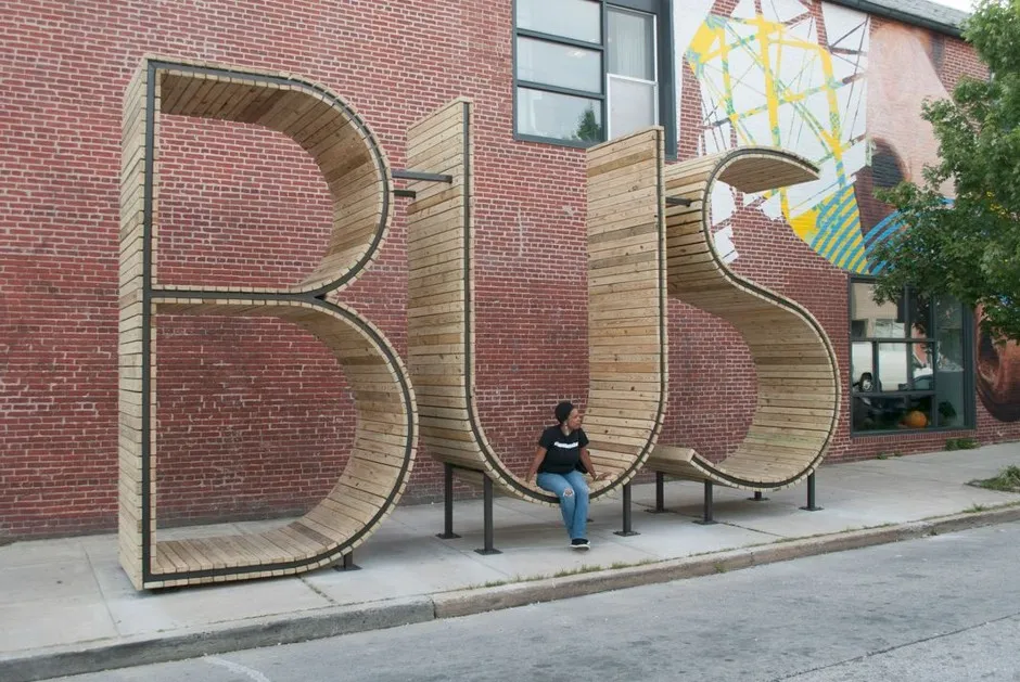 Baltimore Gets a Giant Bus Stop Shaped Like the Word 'Bus' - Bloomberg