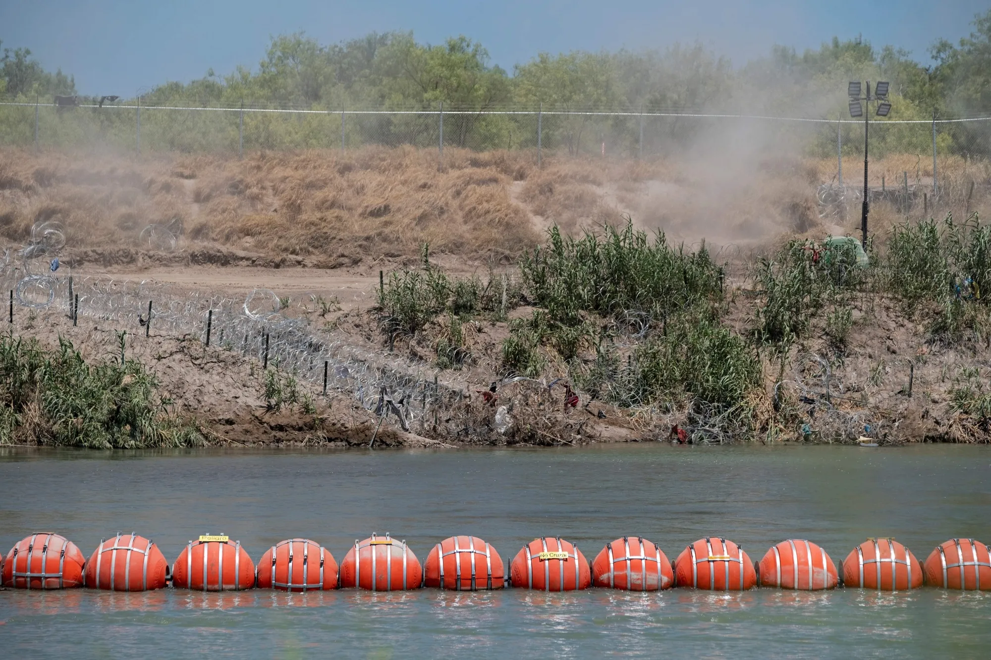 Texas Must Remove Border Barrier at Biden’s Request, Judge Says - Bloomberg