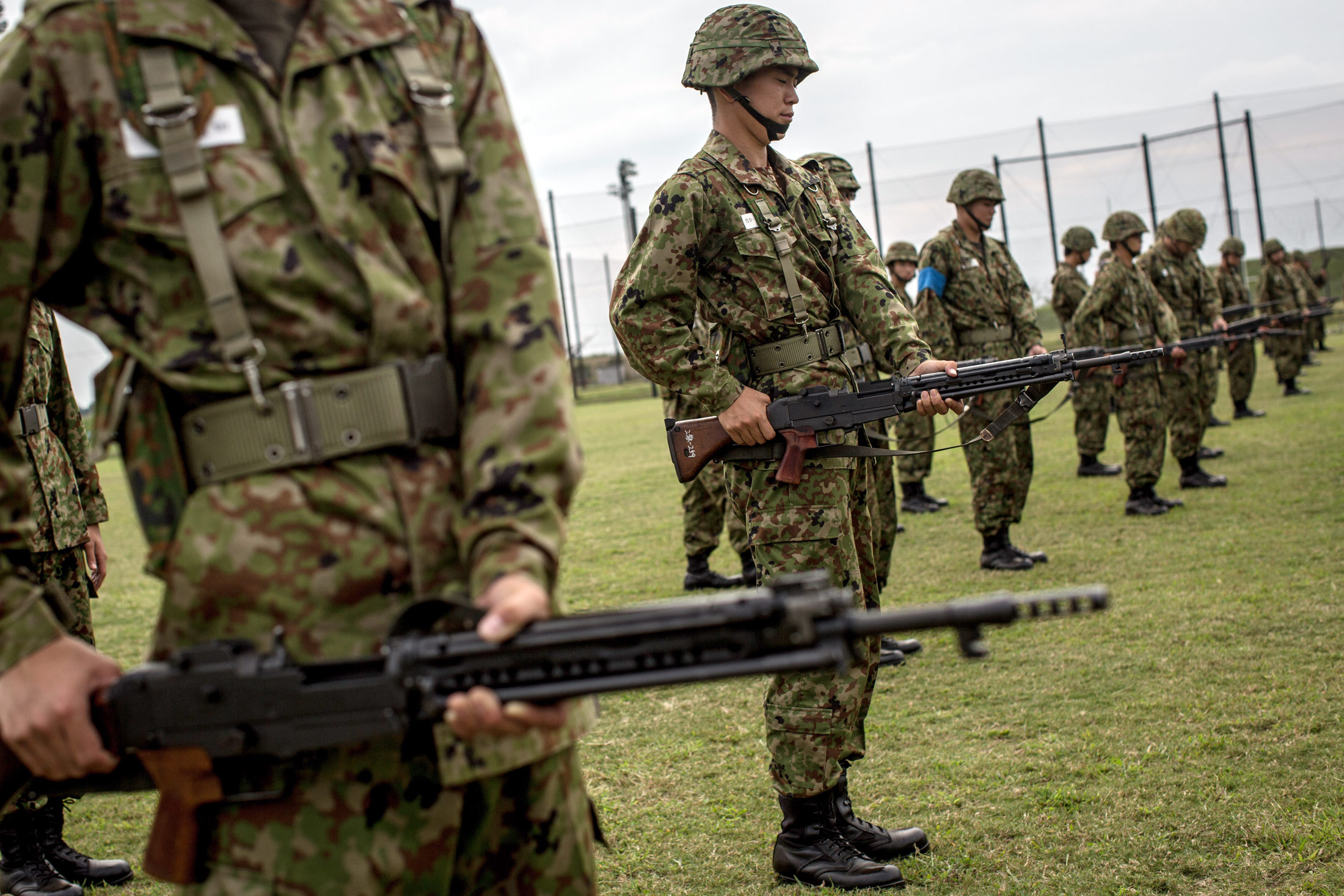 Japan Inches Closer to Tougher Defense Stance - Bloomberg