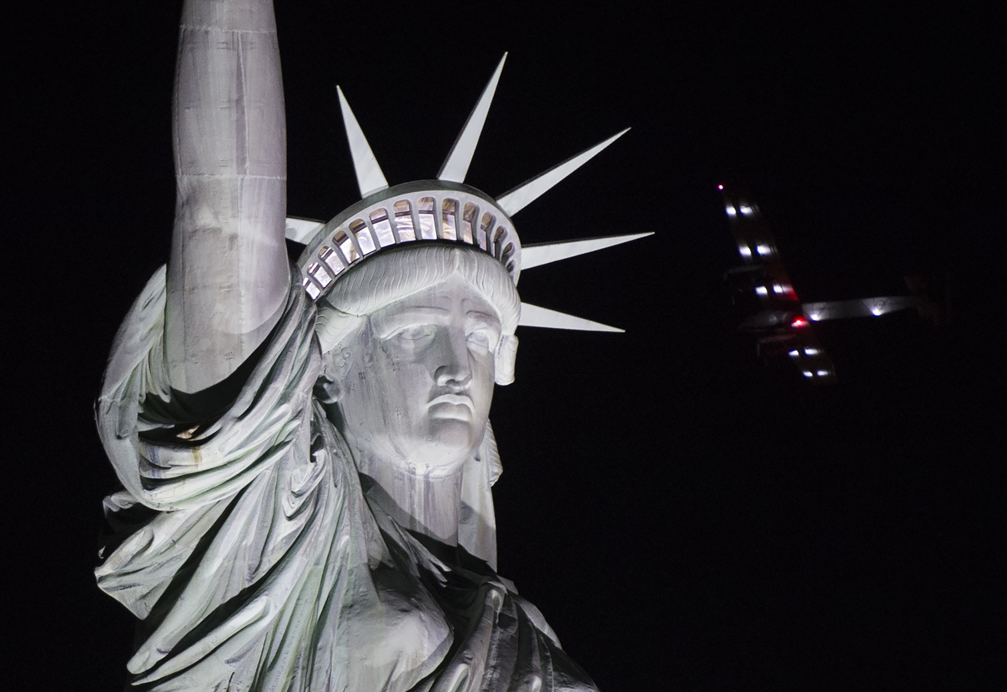 Statue of Liberty Gets Visit by Solar Plane in Dead of Night - Bloomberg