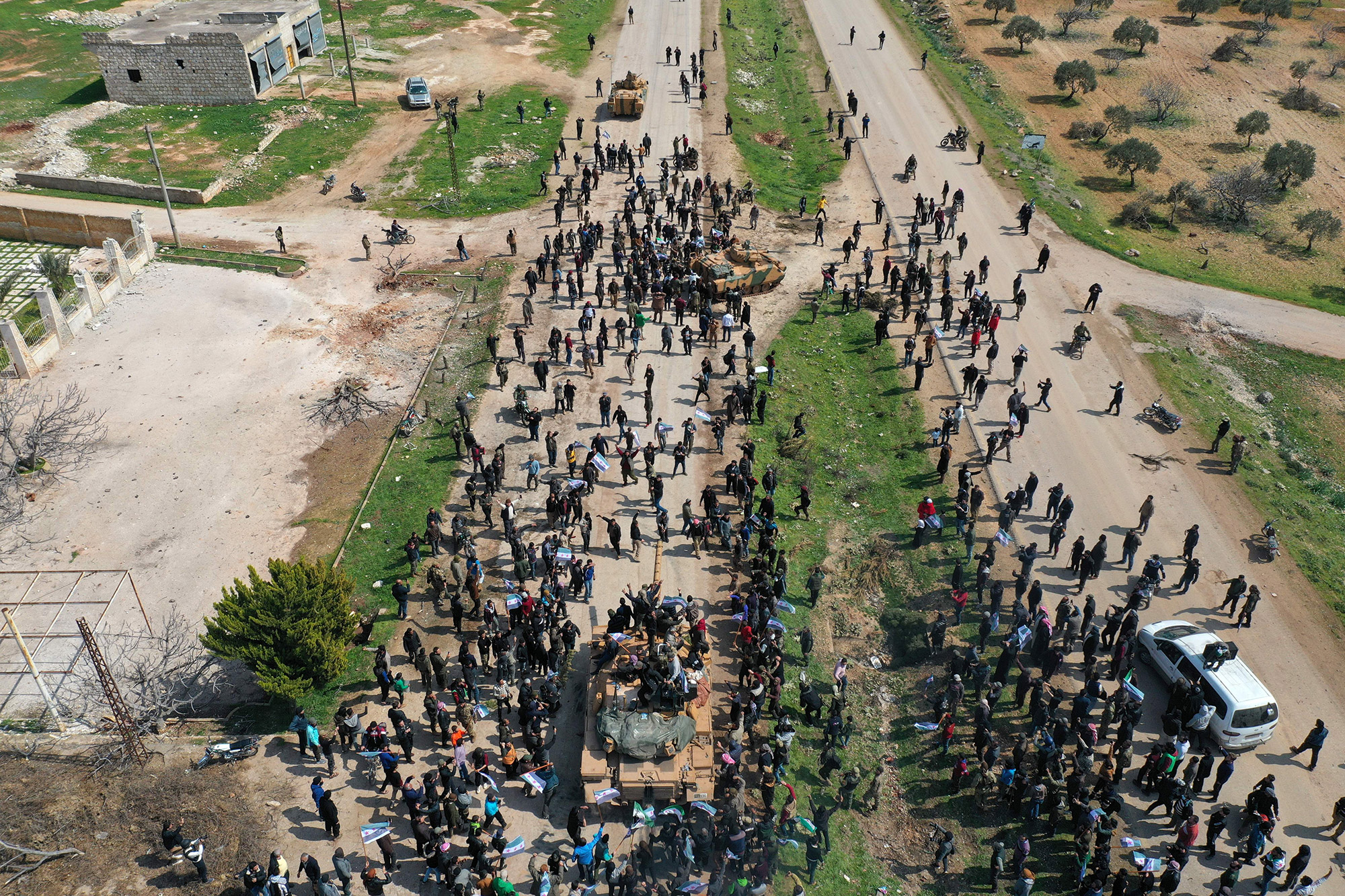 Turkey-Russia Patrols Start Amid Protests on Syrian Highway - Bloomberg