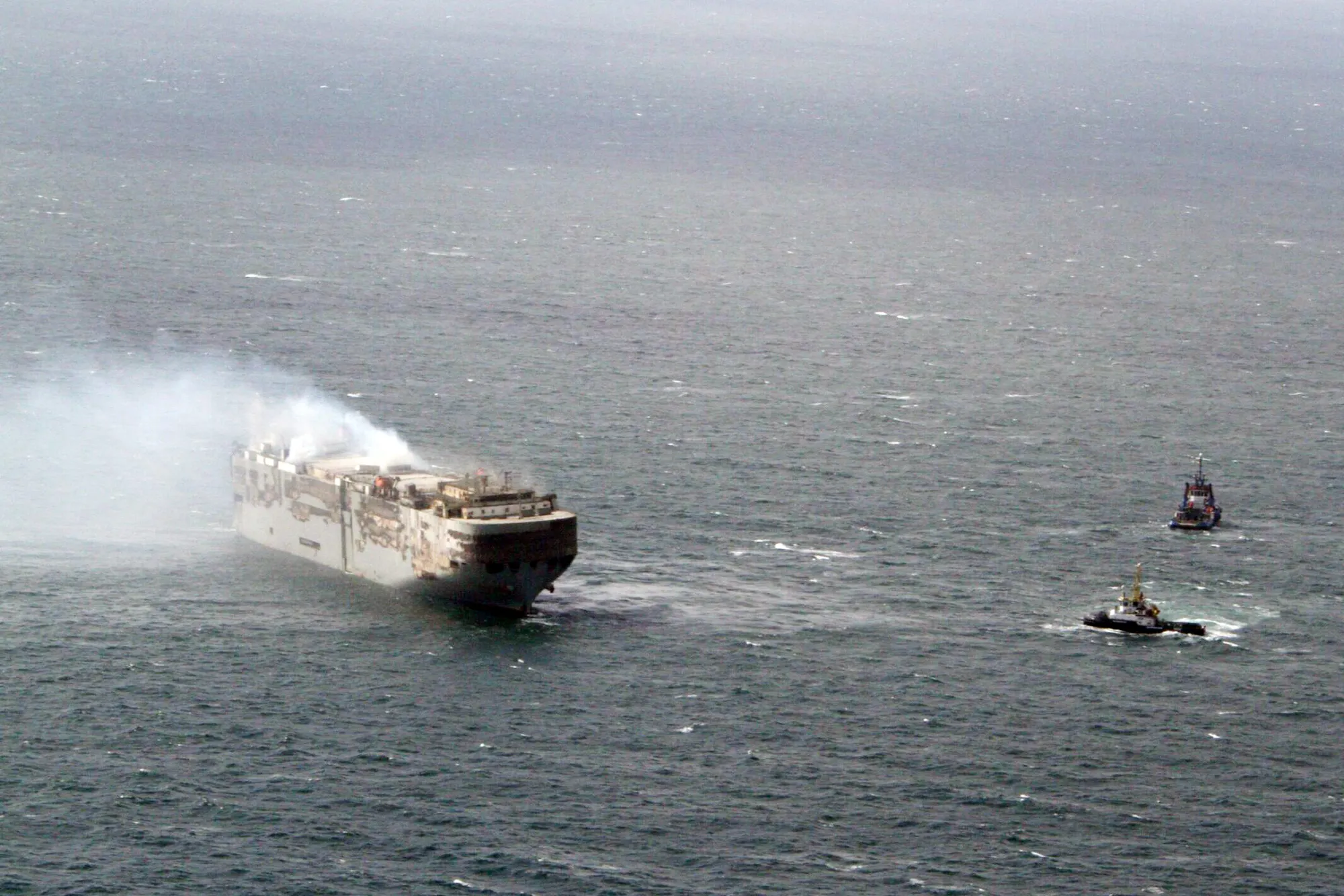 Burning Car-Carrier Ship Towed to New Location Off Dutch Coast - Bloomberg