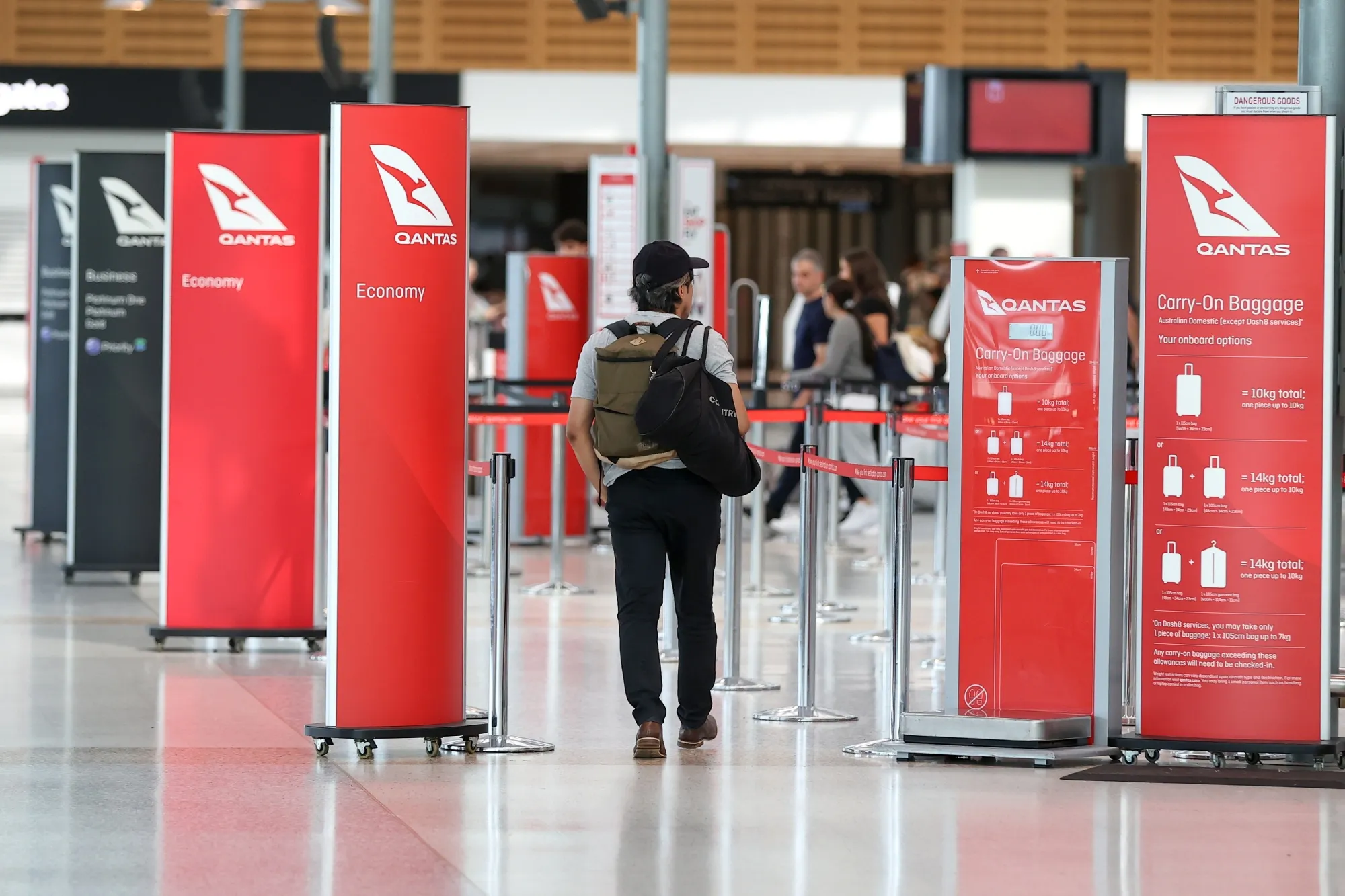 Qantas Profit Falls on Spending to Fix Image, Easing Fares - Bloomberg