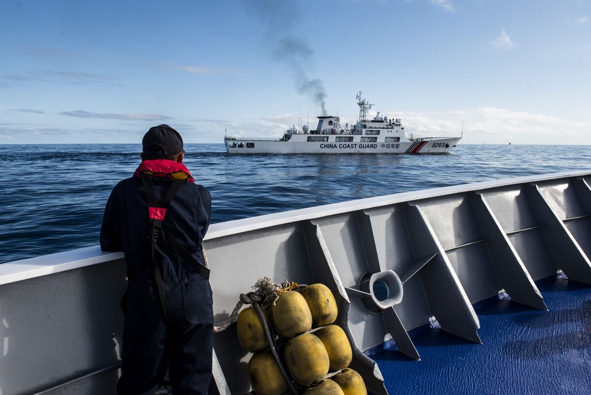 南シナ海で米中の緊張高まる、日米豪比は初の海上演習－QuickTake - Bloomberg