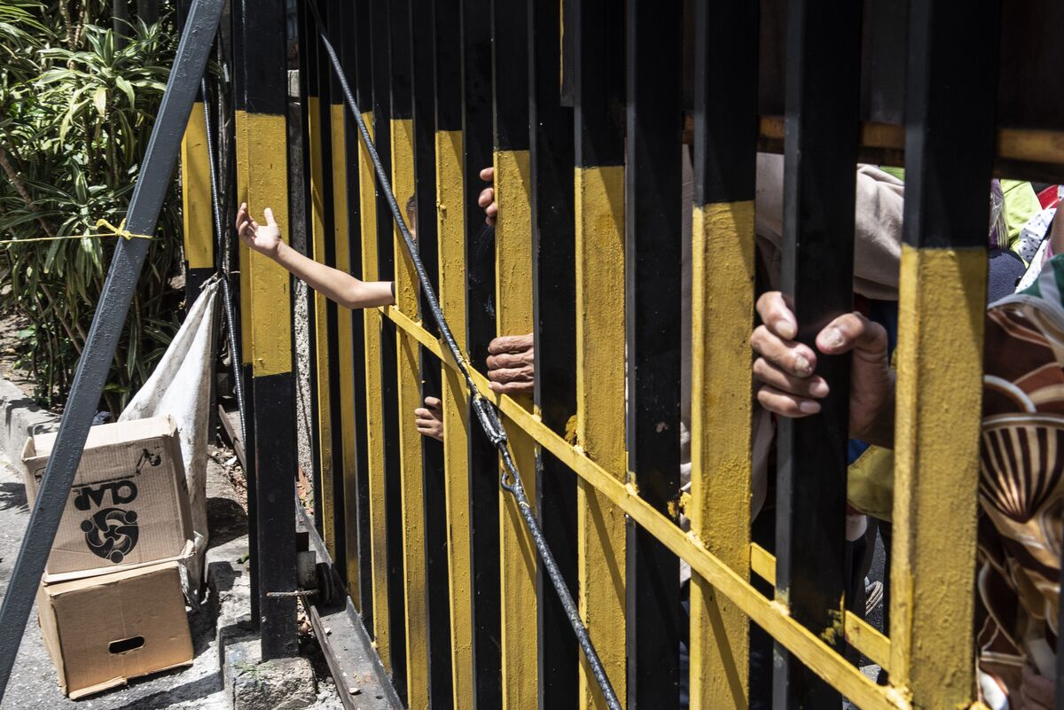 Currency Devaluation Layers on More Chaos in Caracas - Bloomberg
