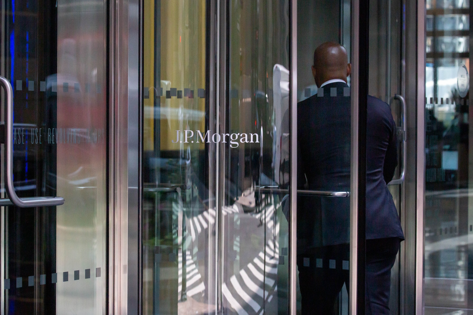 JPMorgan Urges Teams to Exercise Caution, Mask Up If Gathering - Bloomberg