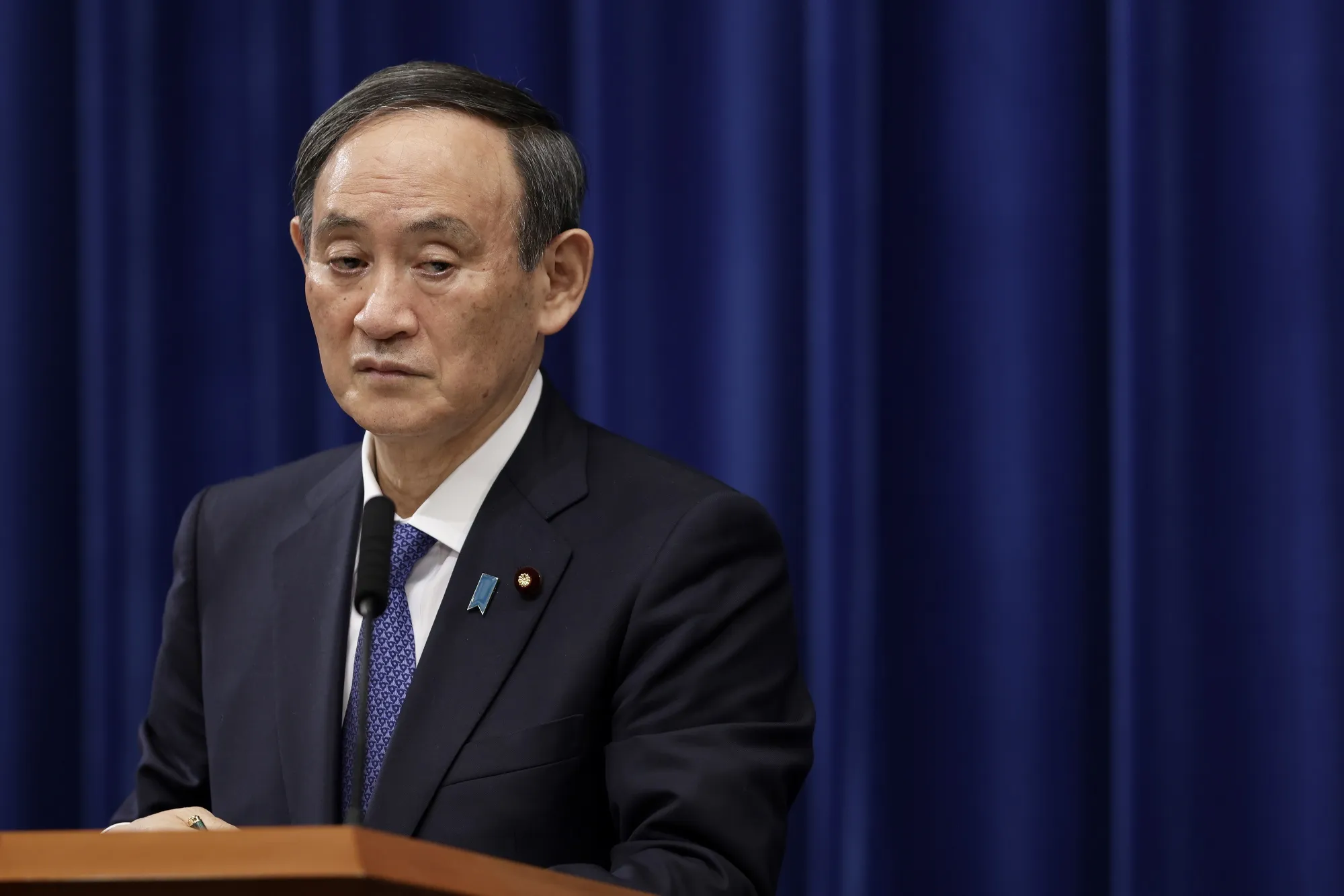 Japanese Premier Suga Vows to Defeat Virus in Policy Speech - Bloomberg